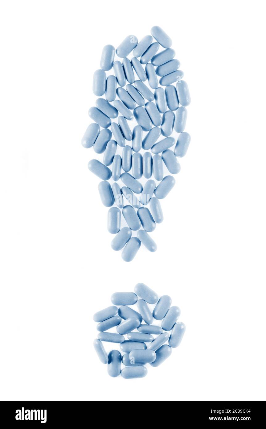Exclamation mark from pills, isolated on white. In trendy classic blue ...