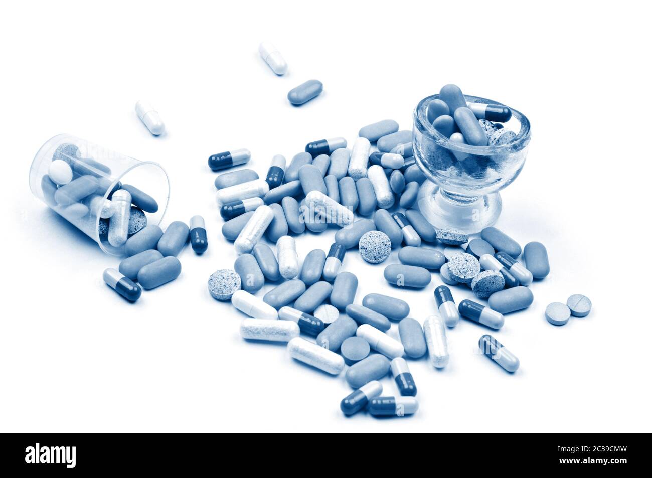 Shot of drugs tablets isolated on white. In trendy classic blue colors ...