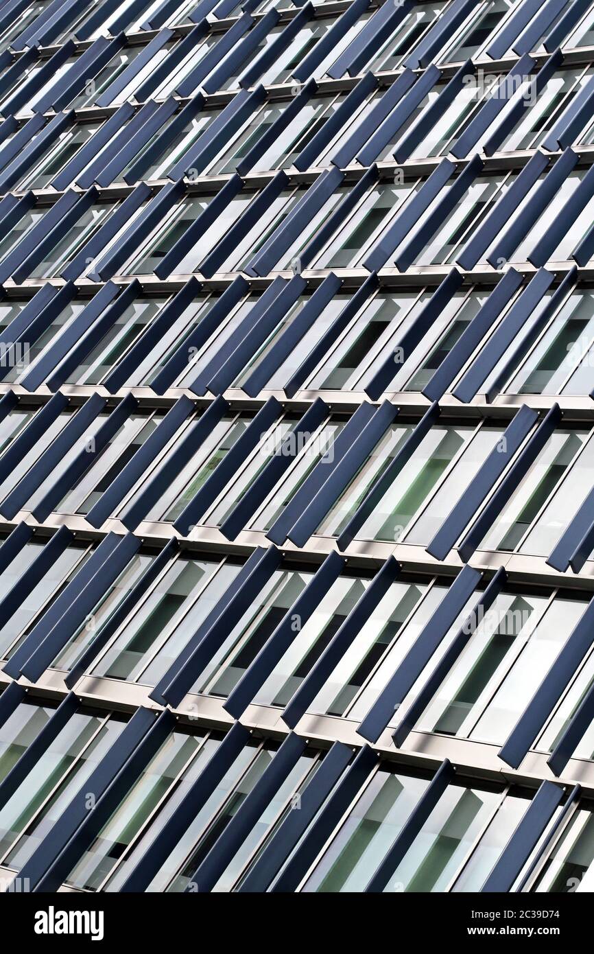 Modern office building with blue fins pattern Stock Photo - Alamy