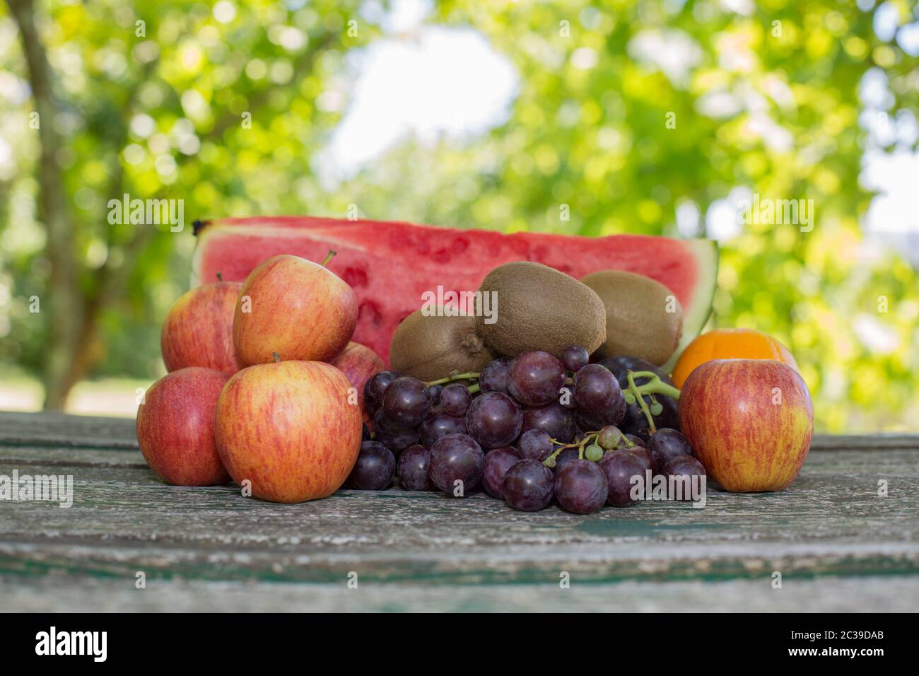 fruits in wooden table, outdoor Stock Photo - Alamy