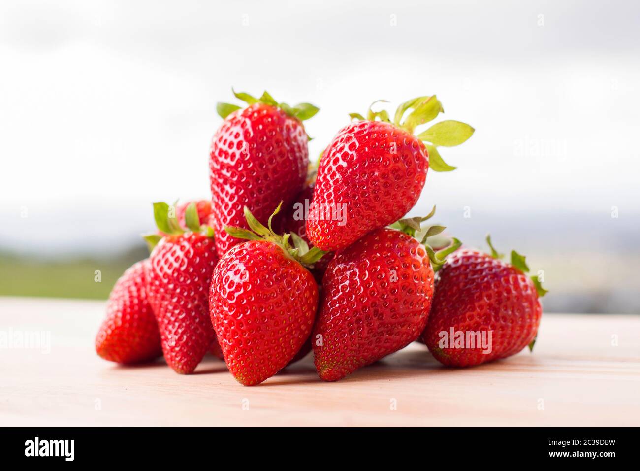 strawberries on garden's table, outdoor picture Stock Photo - Alamy