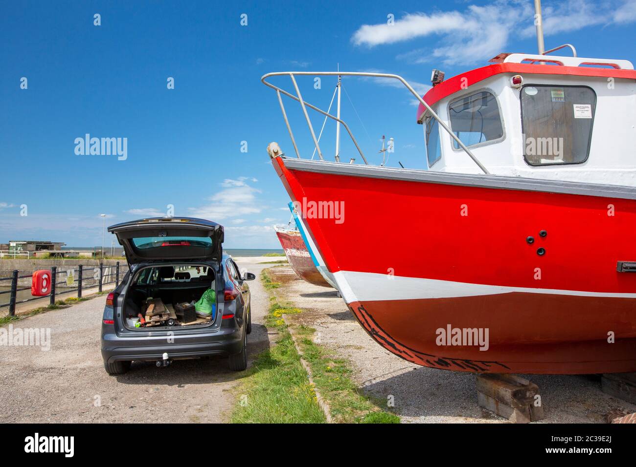 Fishing boats on the harbour at Harrington, near Workington, Cumbria ...