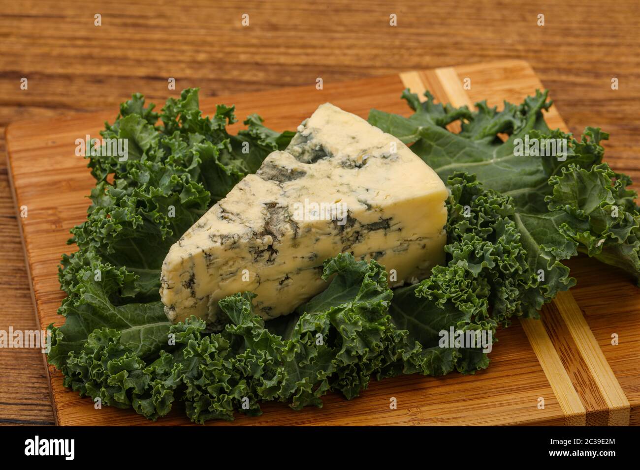 Dairy Blue cheese triangle with mold Stock Photo - Alamy