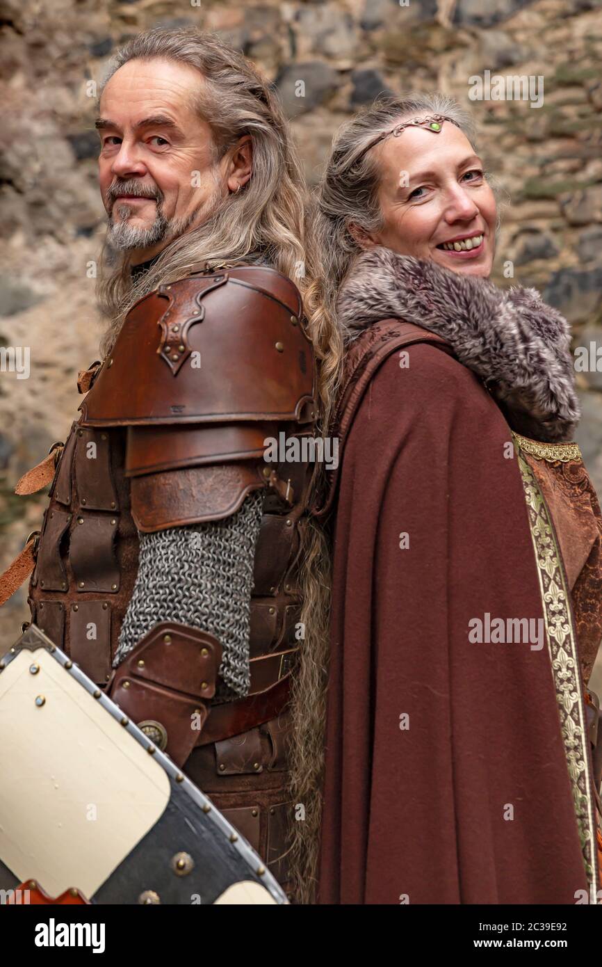Couple posing robed in beautiful medieval clothing Stock Photo - Alamy
