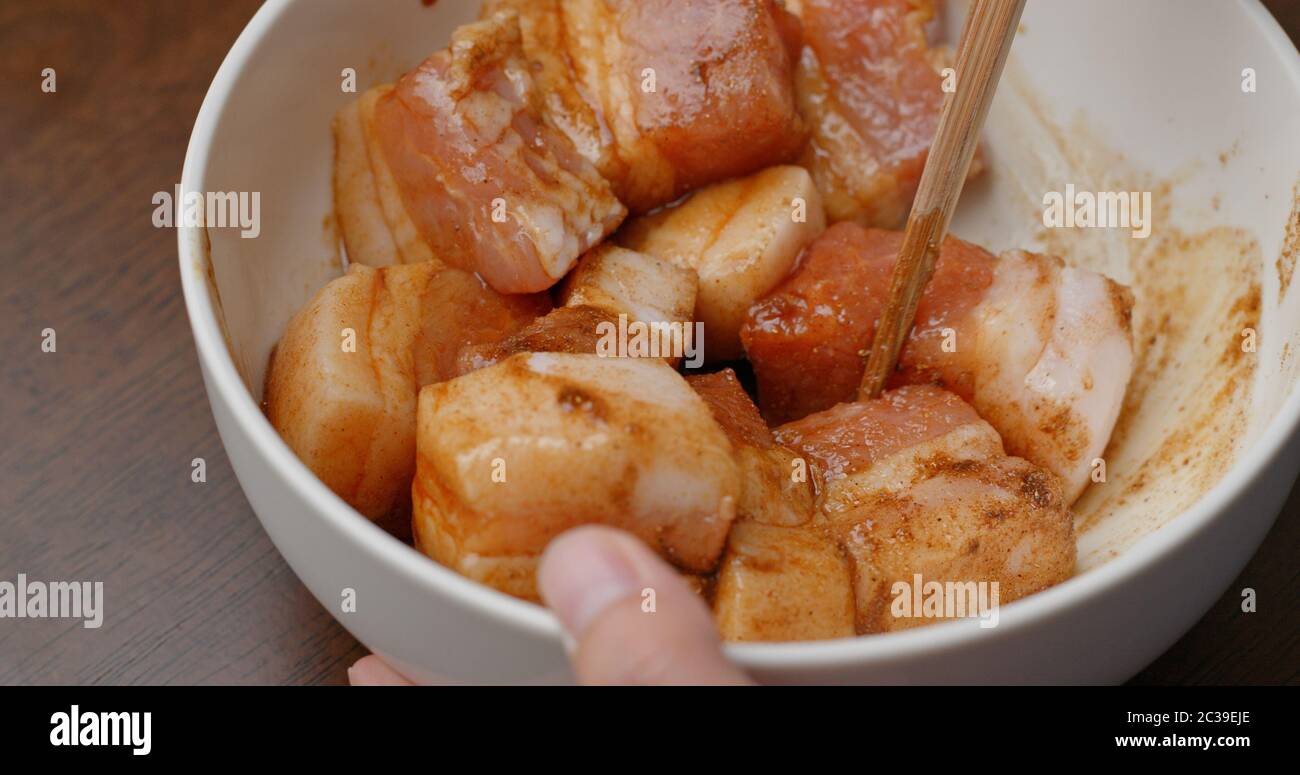 Marinade raw pork belly Stock Photo - Alamy