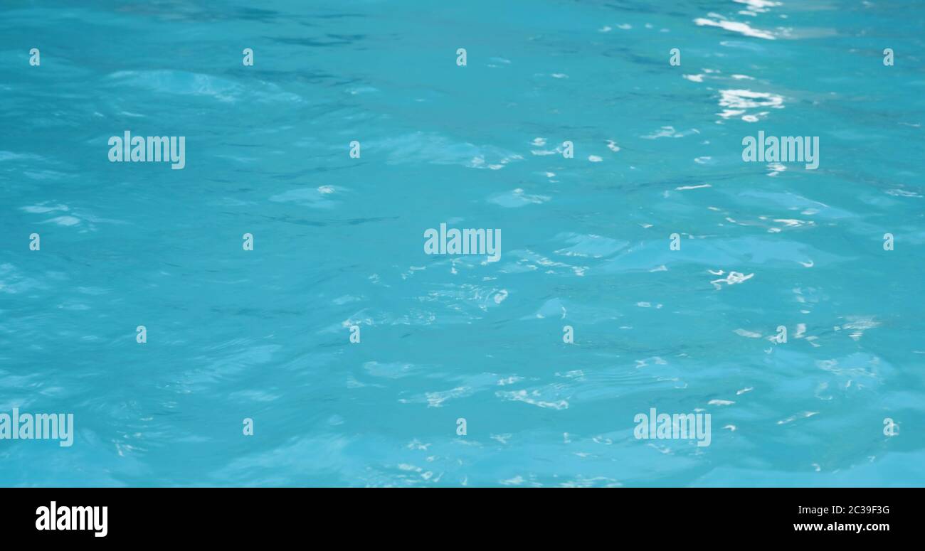 Swimming pool water wave in blue color Stock Photo - Alamy
