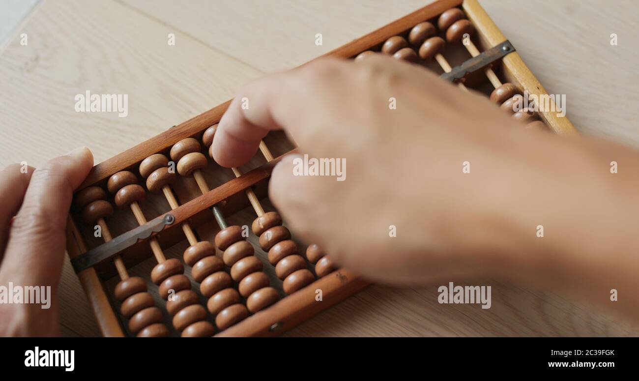 Use of abacus for calculation Stock Photo - Alamy