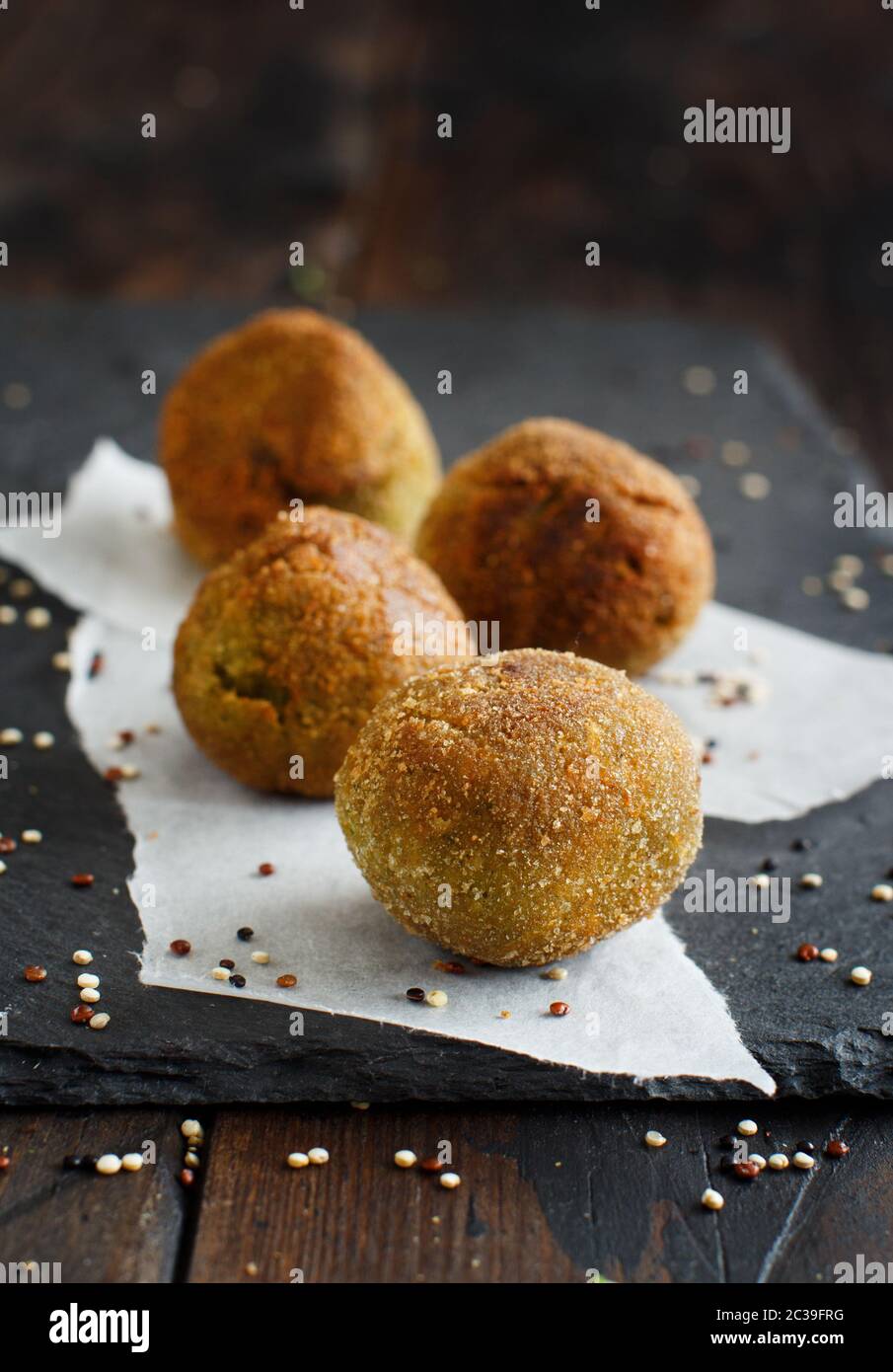 Fried vegetarian falafel with broccoli on a wooden table close up Stock ...