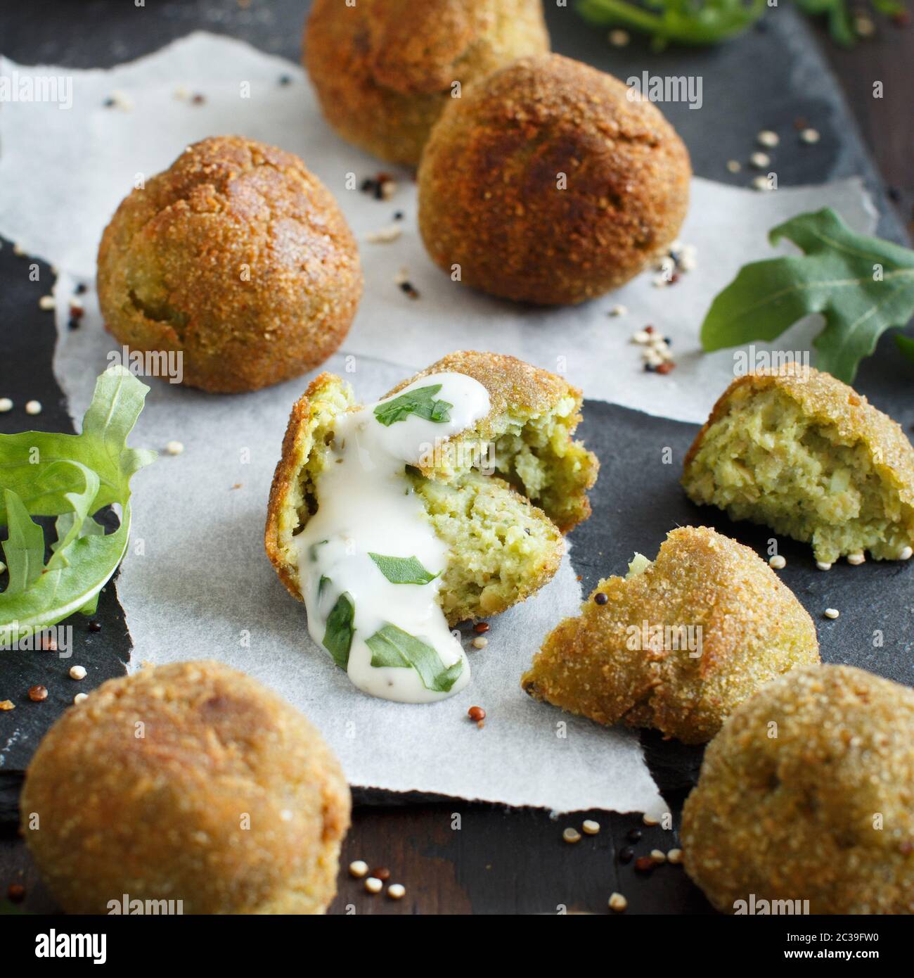 Fried vegetarian falafel with broccoli on a wooden table close up Stock ...