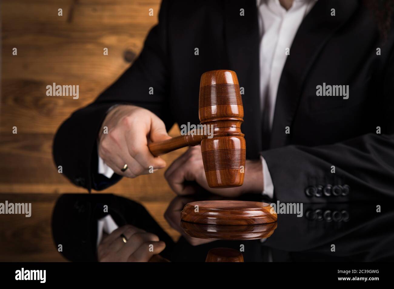 Judge, male judge in a courtroom striking the gavel Stock Photo - Alamy