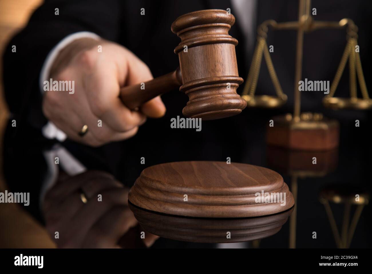 Judge, male judge in a courtroom striking the gavel Stock Photo - Alamy