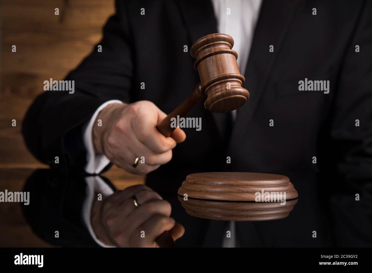 Judge, male judge in a courtroom striking the gavel Stock Photo - Alamy