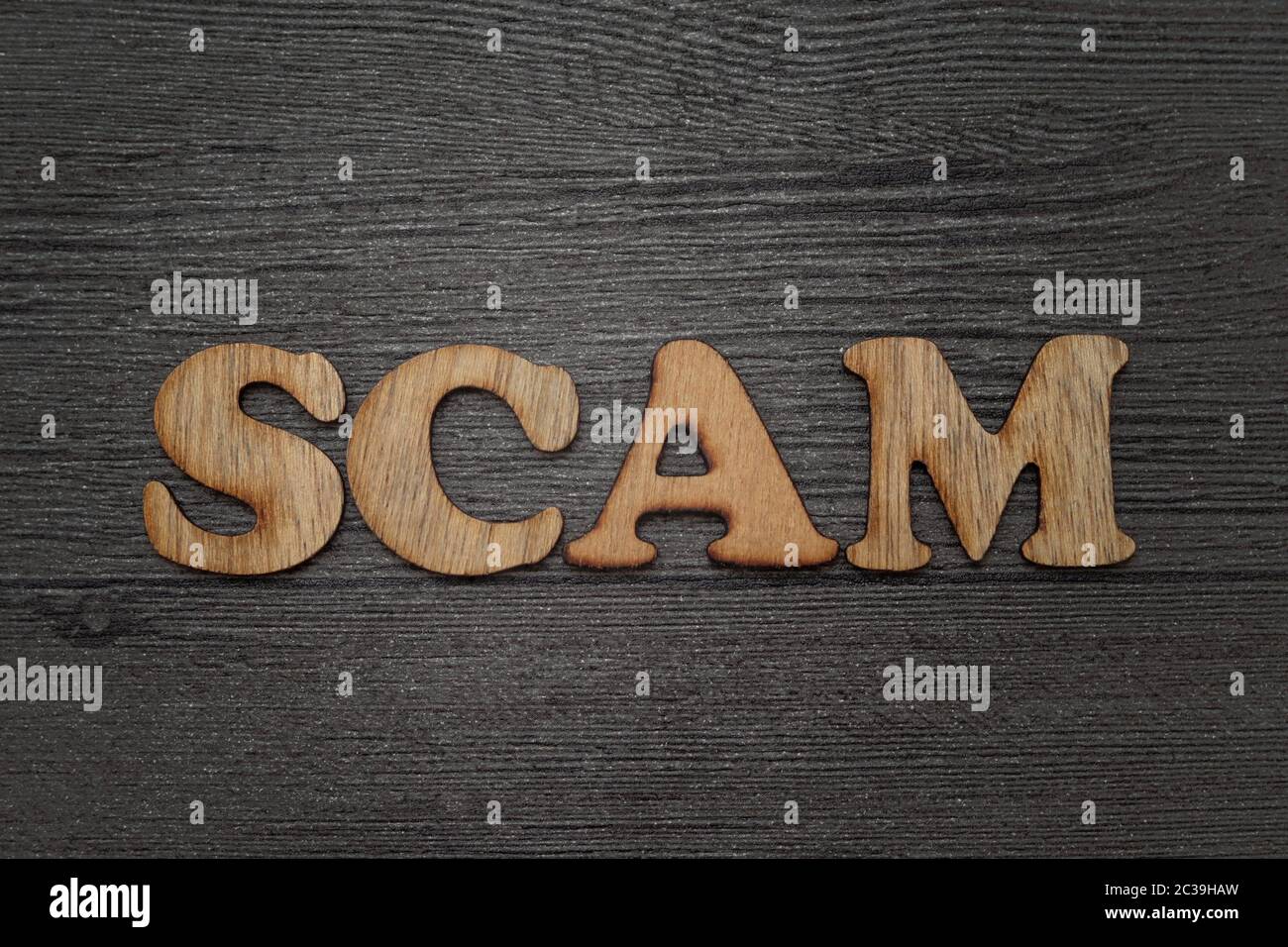 scam text word concept, wooden lettering alphabet typography over ...