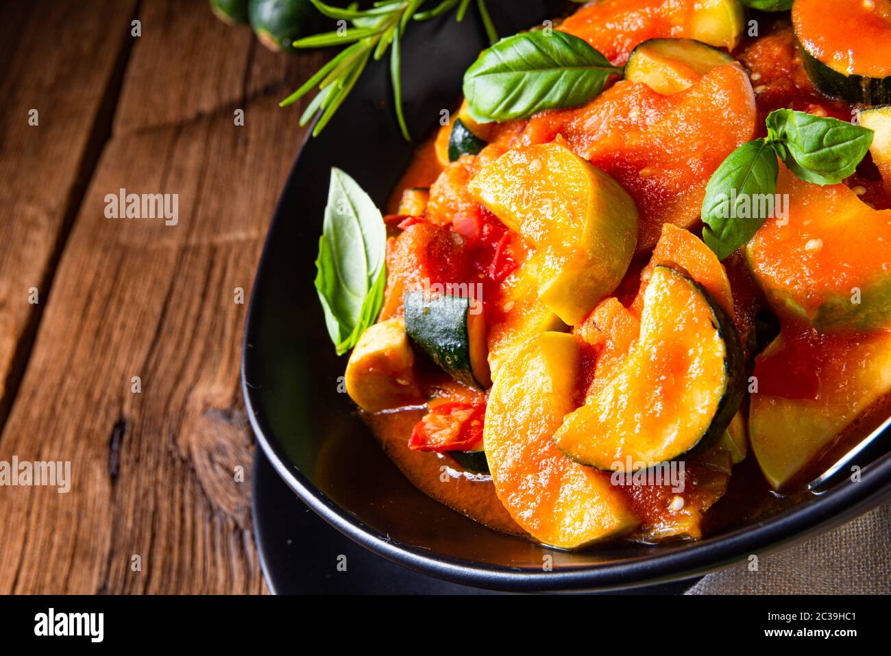 zucchini vegetarian ratatouille with tomato sauce and herbs Stock Photo ...
