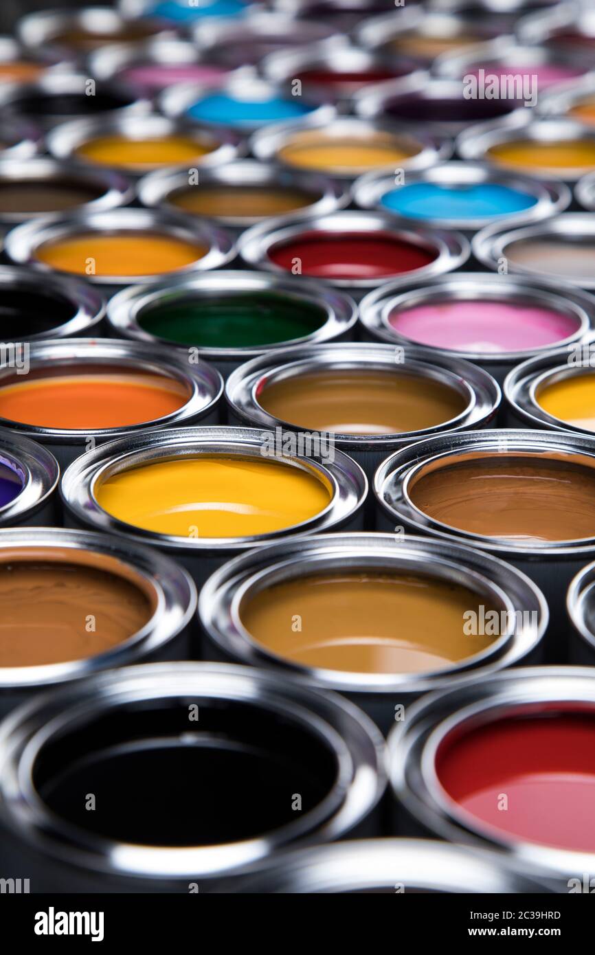 Group of tin metal cans with color paint Stock Photo - Alamy