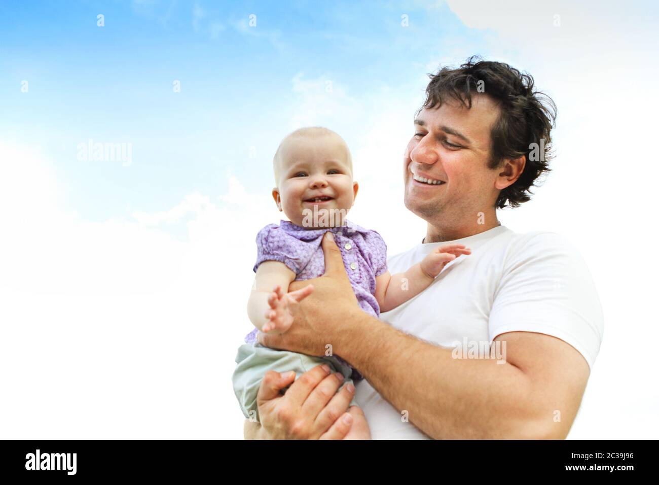 Happy father with baby in rural field Stock Photo - Alamy