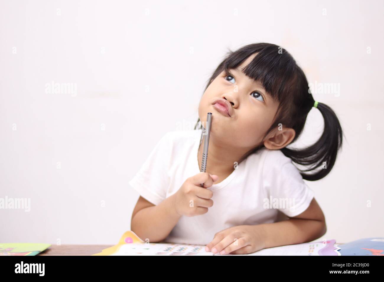 Cute chinese baby girl thinking hi-res stock photography and images - Alamy