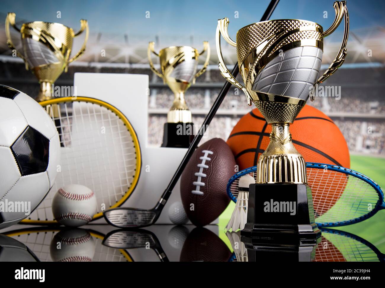 Trophy cup and sport ball background Stock Photo - Alamy