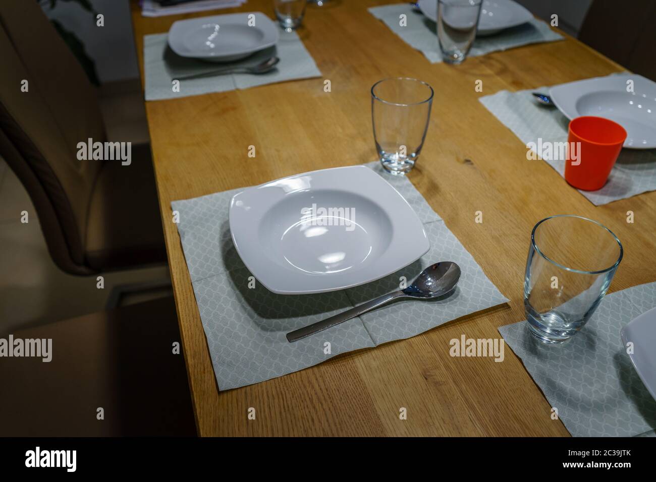 Table setting with Plate and Spoon Stock Photo - Alamy