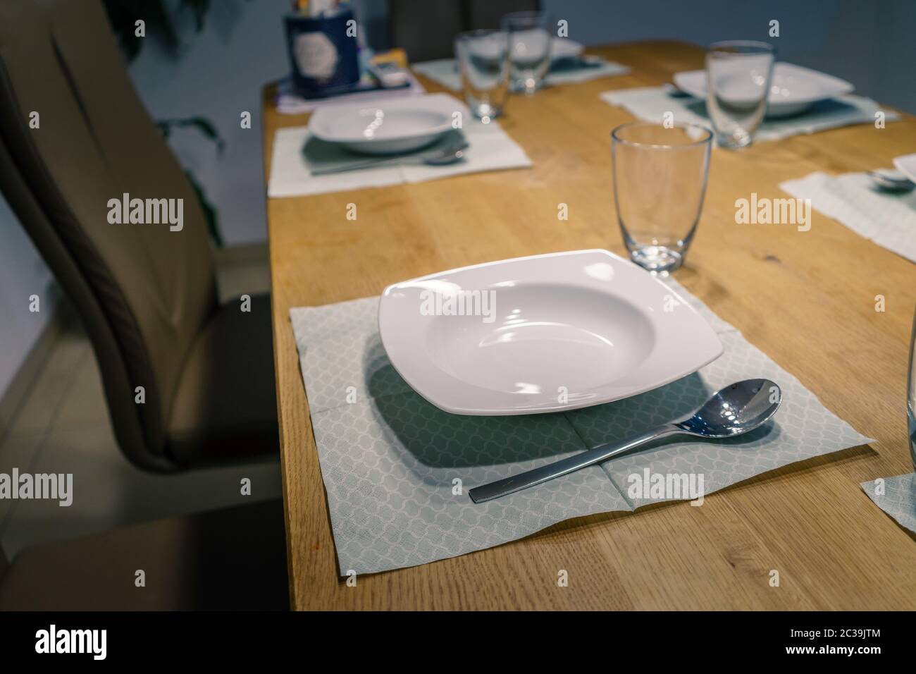 Table setting with Plate and Spoon Stock Photo - Alamy