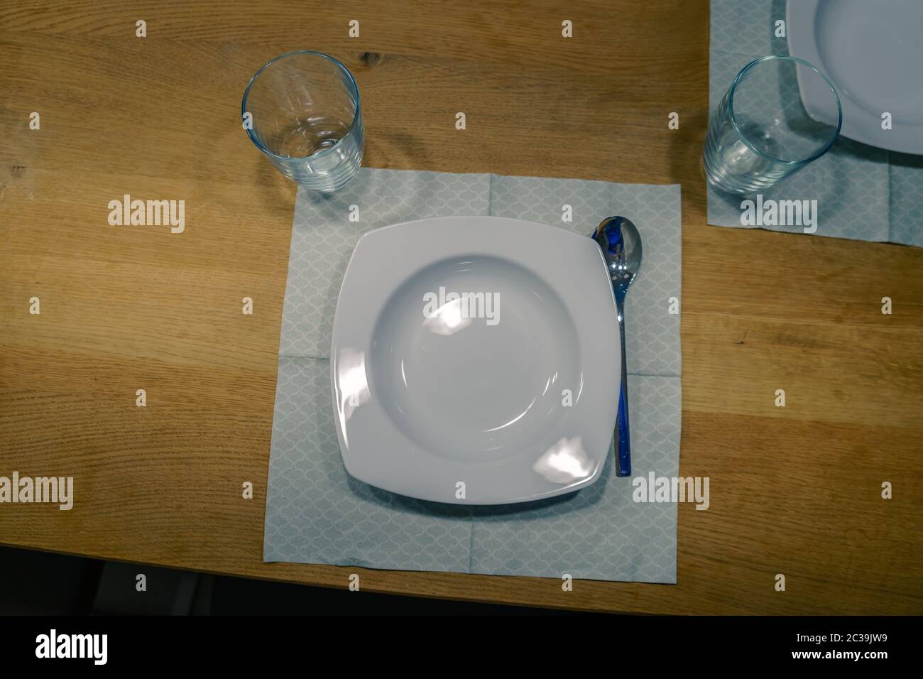 Table setting with Plate and Spoon Stock Photo - Alamy