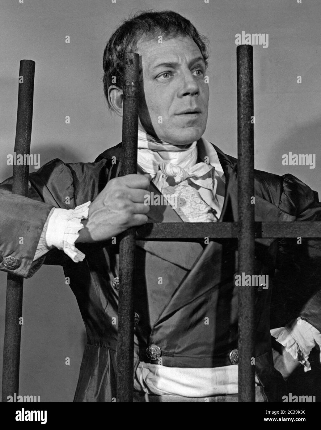 The actor and director Peter Luehr is dressed in costume and looks over ...