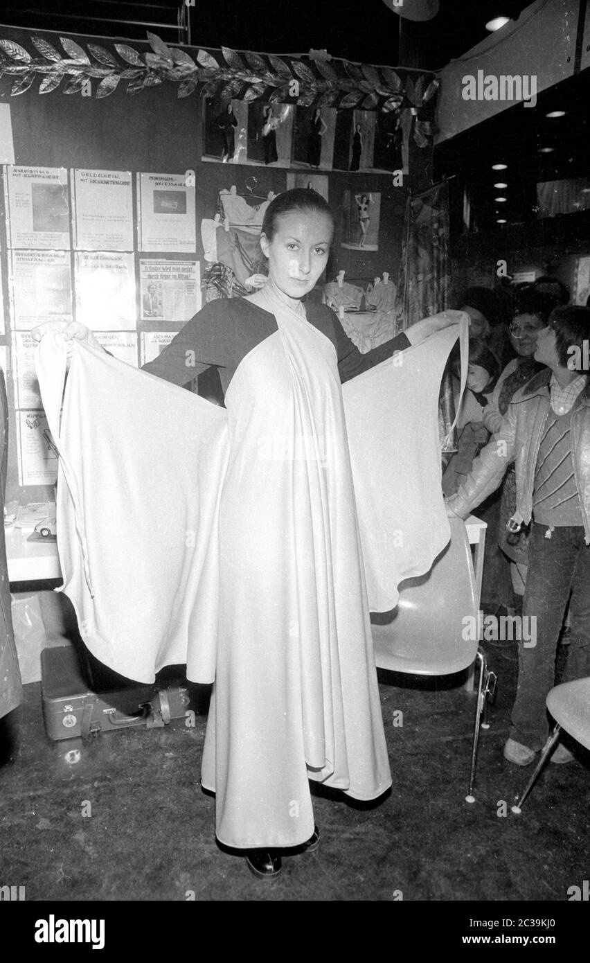 A woman presents a new wrap dress at the "Inventor and Novelty ...