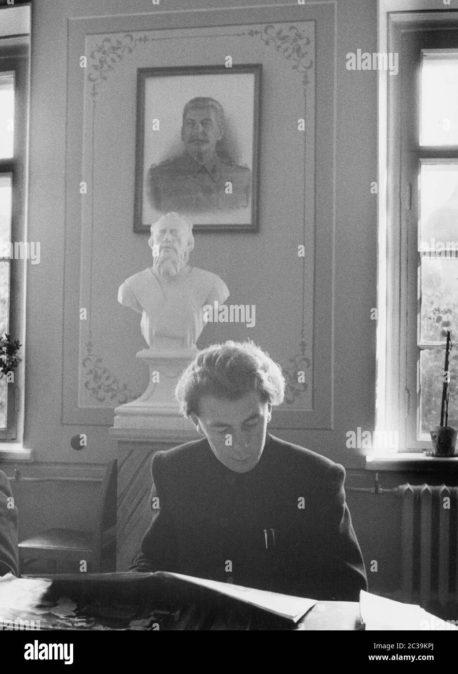 A student priest in the Zagorsk Monastery while studying. On the wall ...