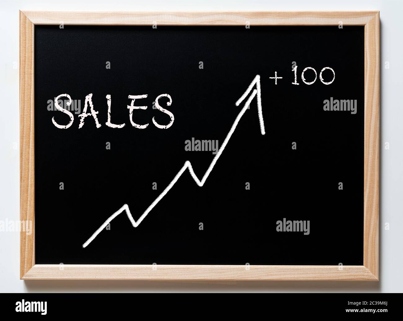 a blackboard with written the word sales Stock Photo - Alamy
