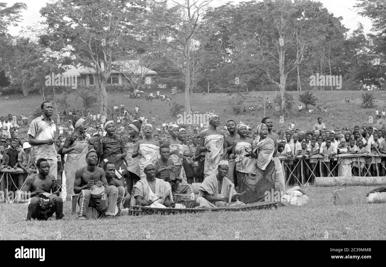 Men and women from Sierra Leone make music with traditional instruments ...