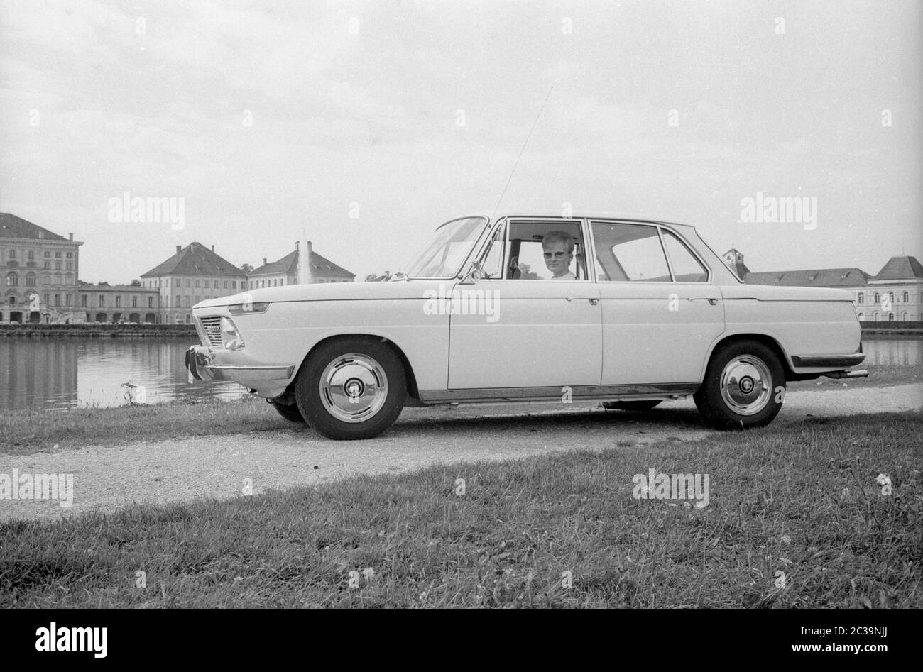 BMW 2000 TI 1966 against the background of Nymphenburg Palace in Munich ...