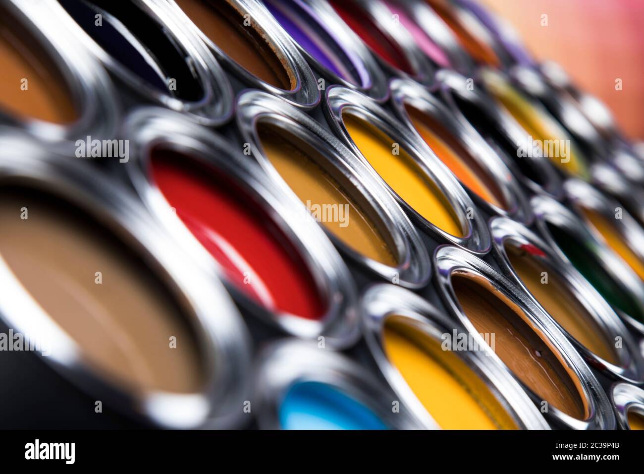 Group of tin metal cans with color paint Stock Photo - Alamy