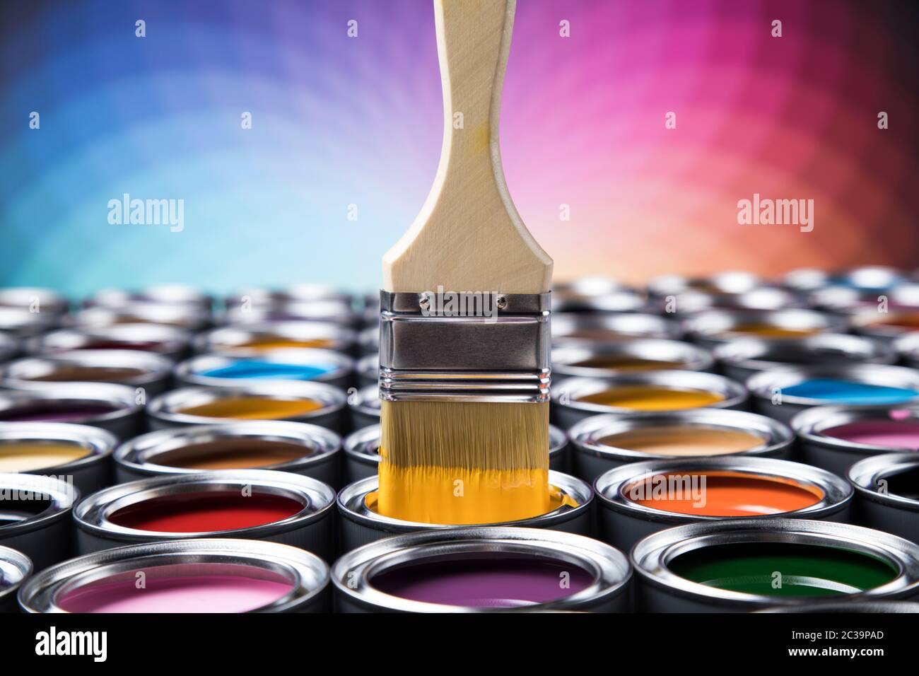 Tin metal cans with color paint and paintbrush Stock Photo - Alamy