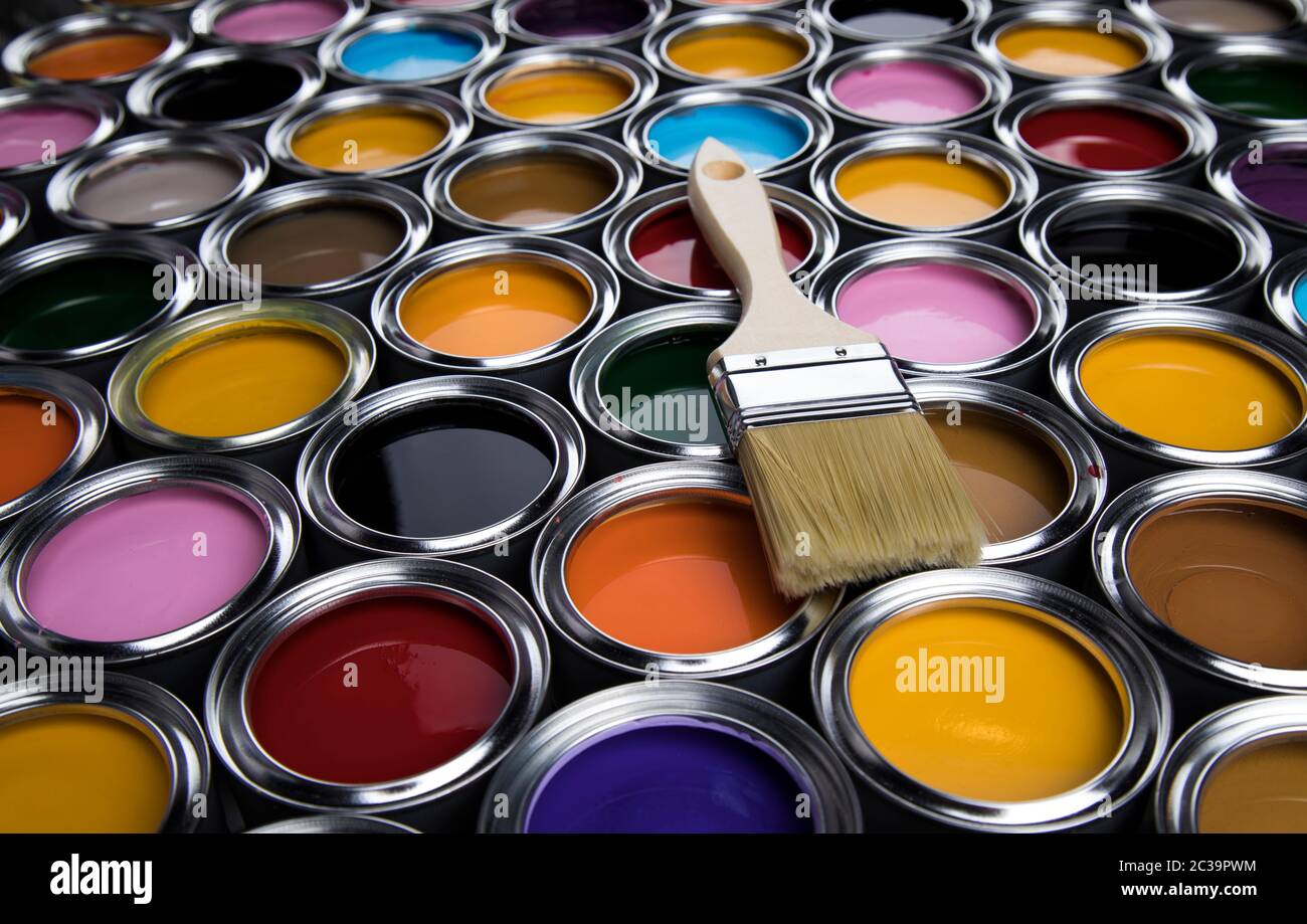 Metal tin cans with color paint and paintbrush Stock Photo - Alamy