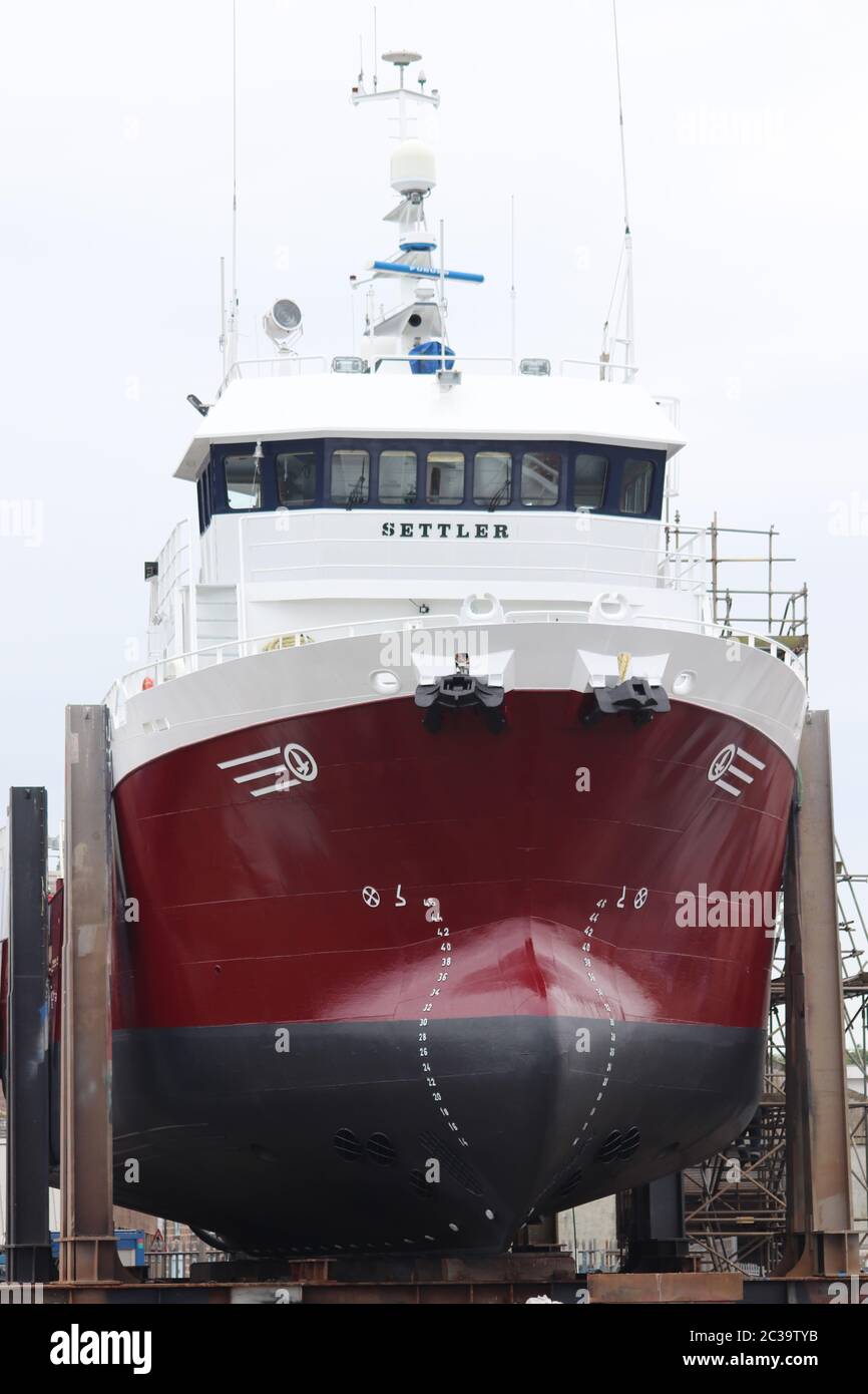 Fishing boat in dry dock Stock Photo - Alamy