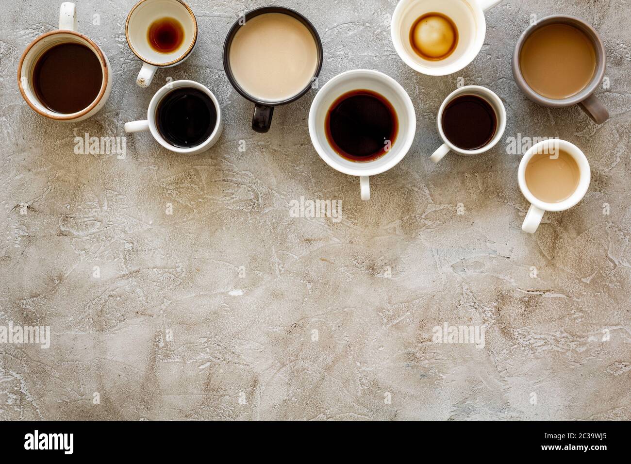 Cups of hot drinks on beige table top-down space for text Stock Photo ...