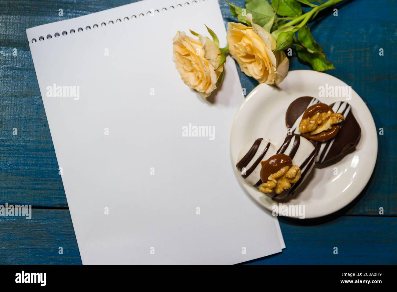 romantic coffee background with sweet cookies and roses with ...