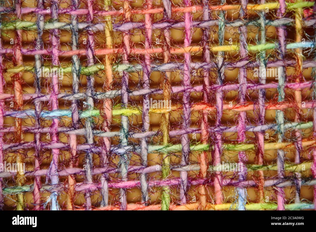 colorful yarns woven in loom frame by hand Stock Photo - Alamy