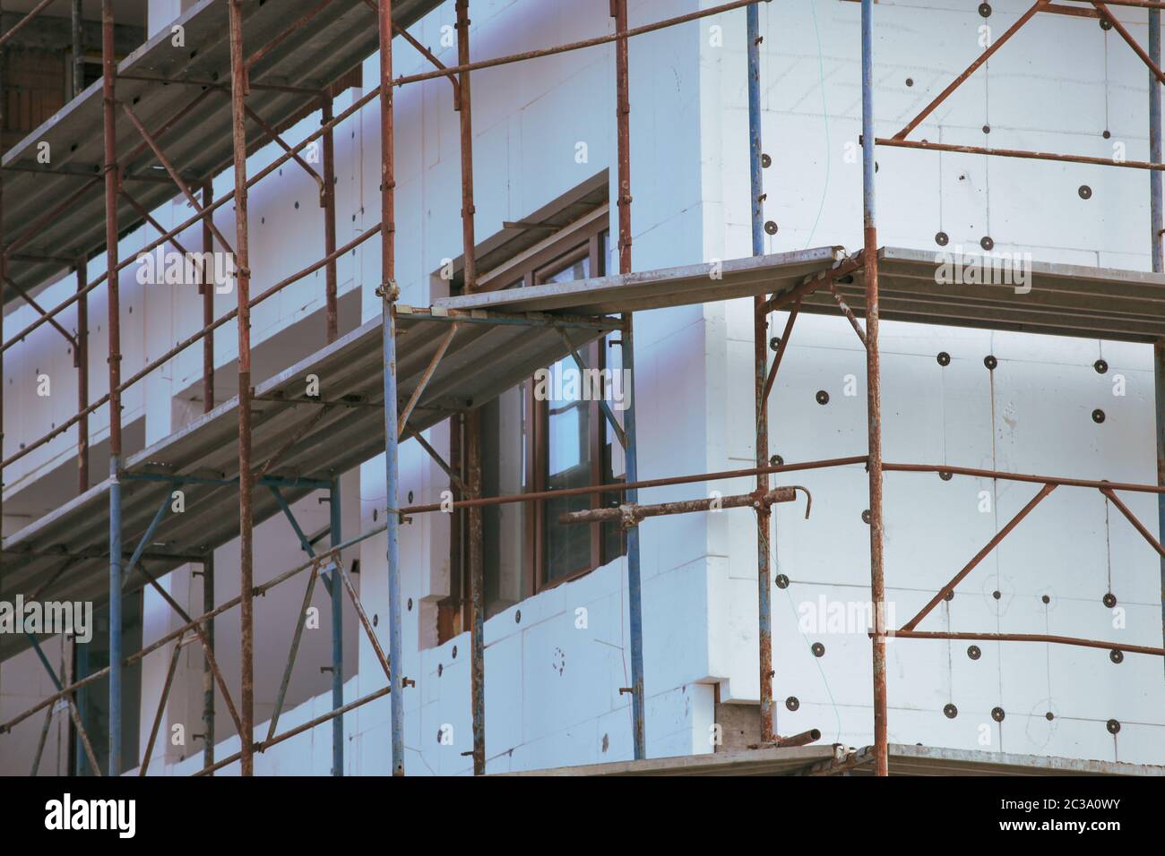 The process of renovating a new building. New construction, exterior ...