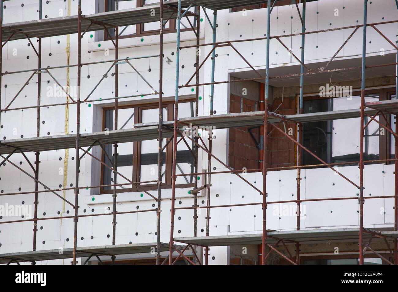 The process of renovating a new building. New construction, exterior ...