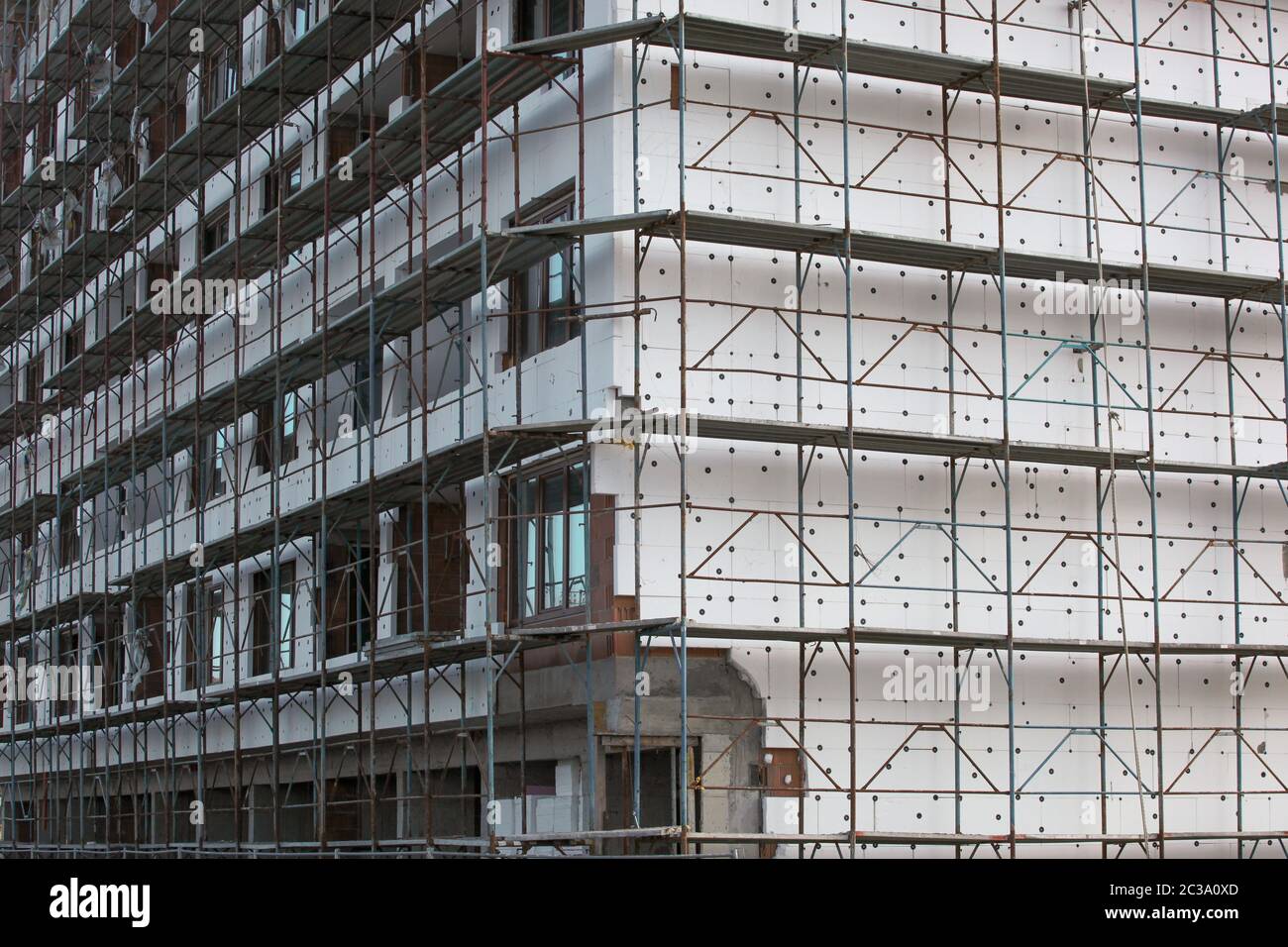 The process of renovating a new building. New construction, exterior ...