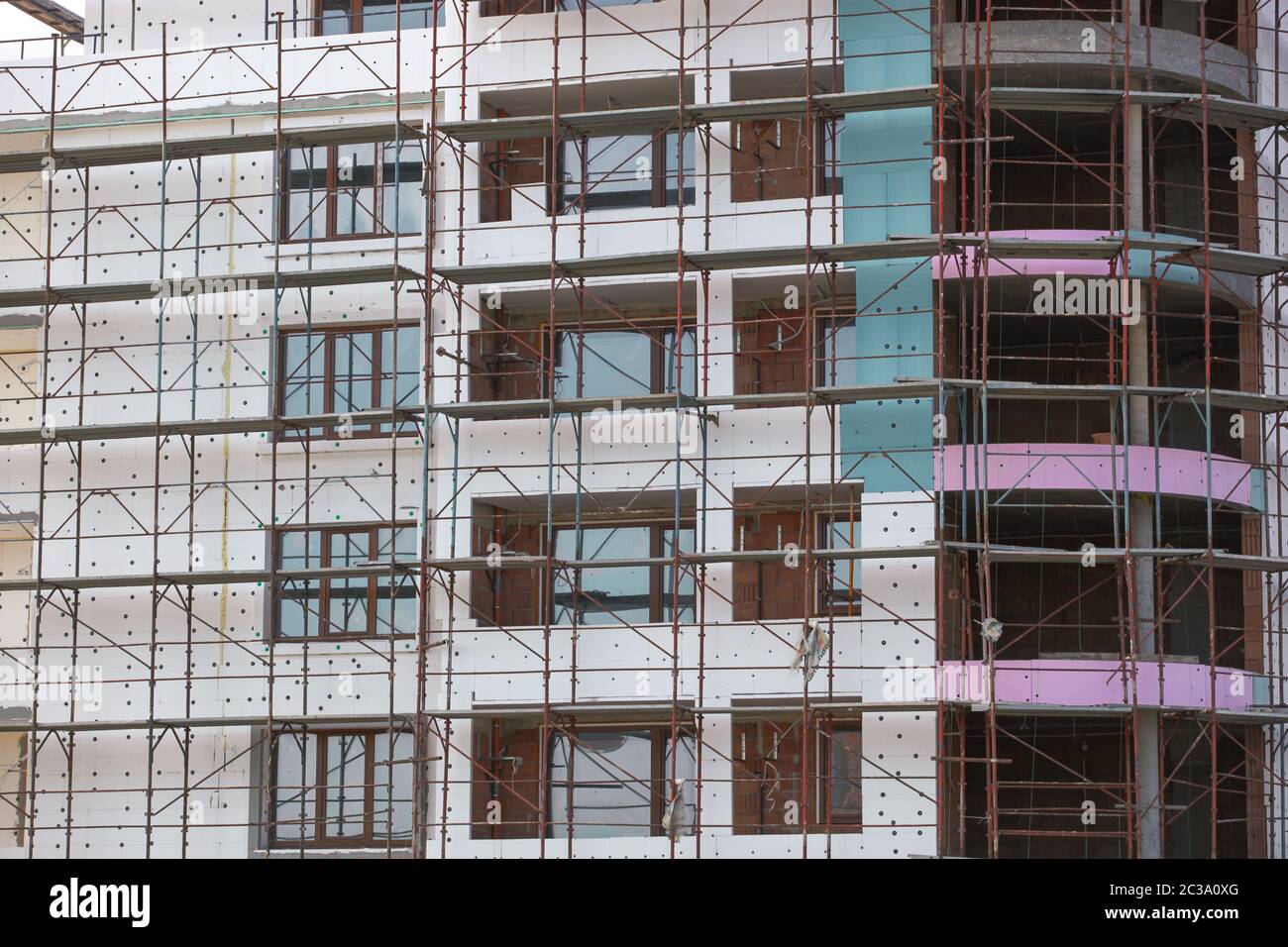 The process of renovating a new building. New construction, exterior ...