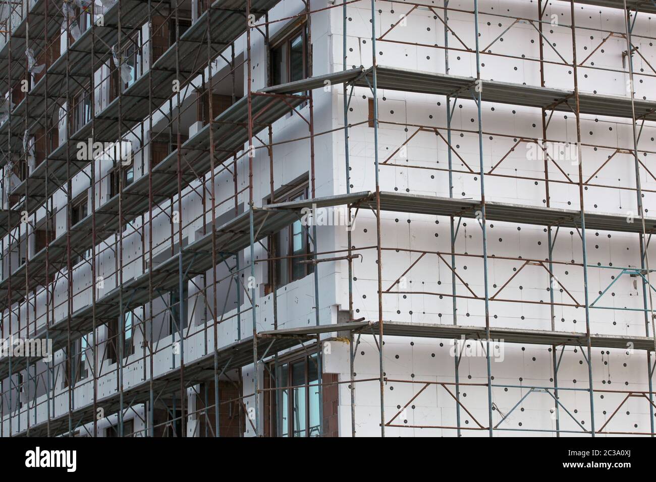 The process of renovating a new building. New construction, exterior ...
