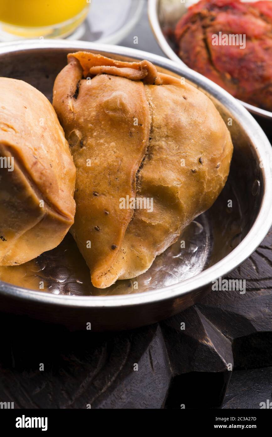 Veg Samosa - is a crispy and spicy Indian triangle shape snack Stock ...