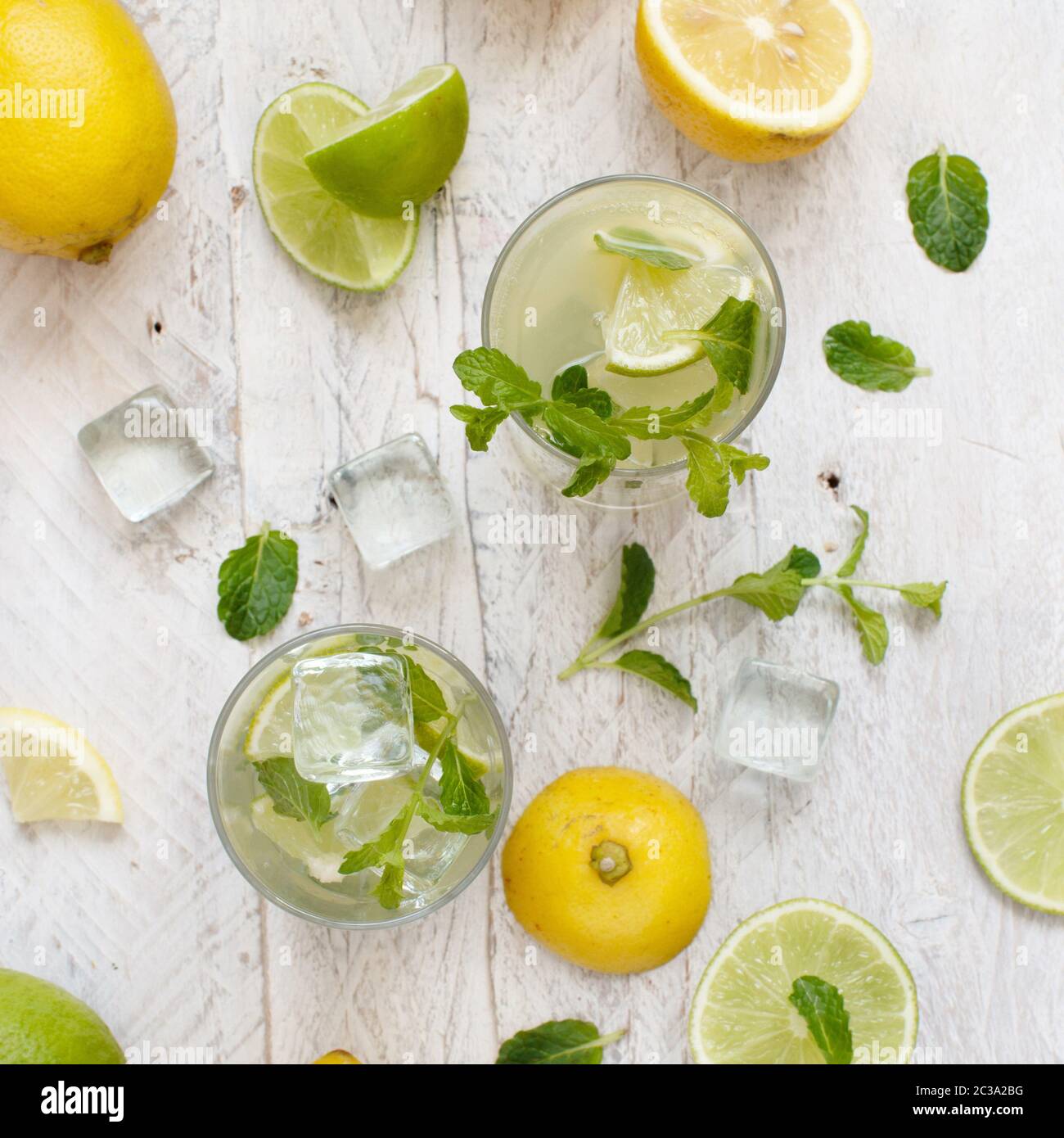 Homemade refreshing drink with lemon and lime juice and mint top view ...