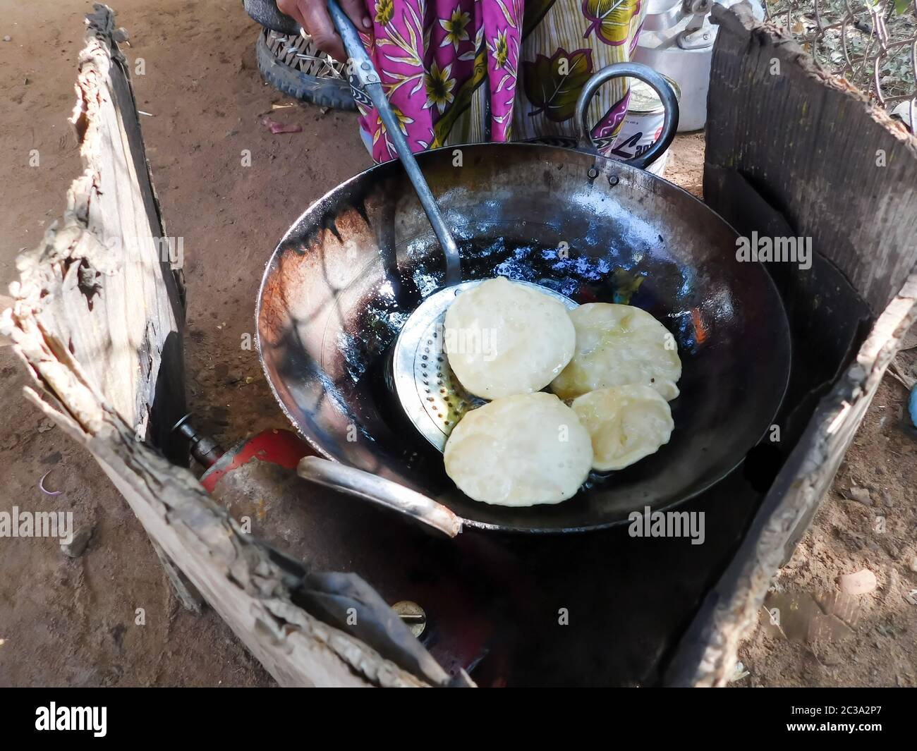 Making of fluffy Phulko Luchi puri cuisine, a traditional Bengali style ...