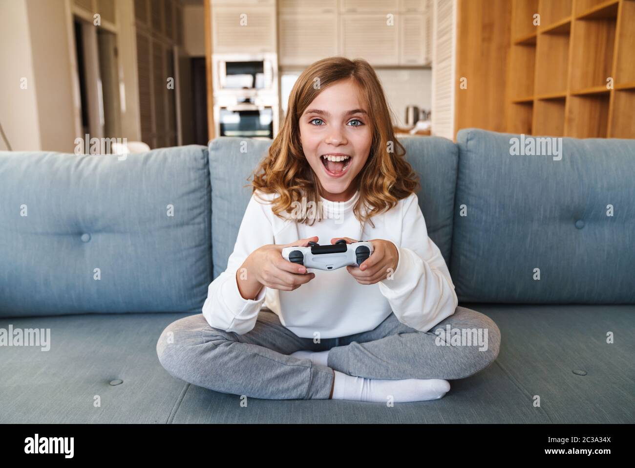 Girl playing playstation game hi-res stock photography and images - Alamy