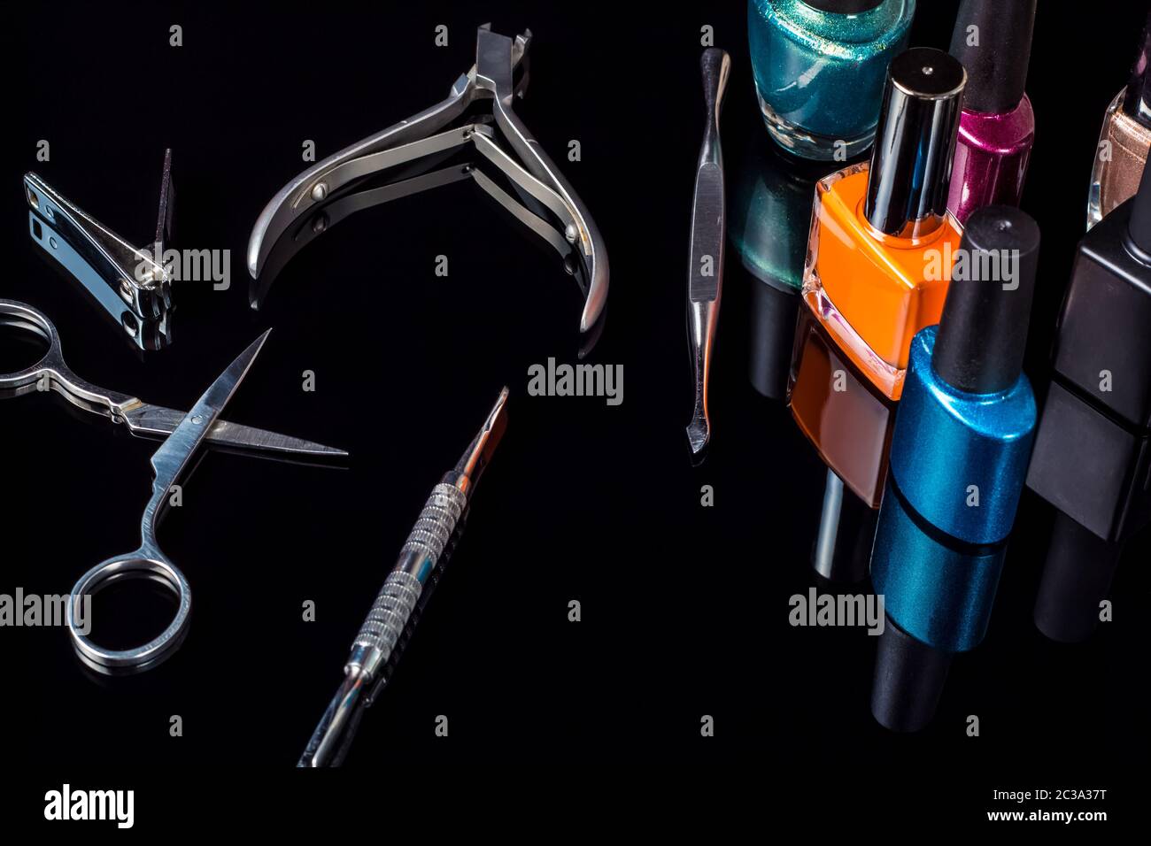 Manicure and pedicure tools on black background, isolated. Equipment ...