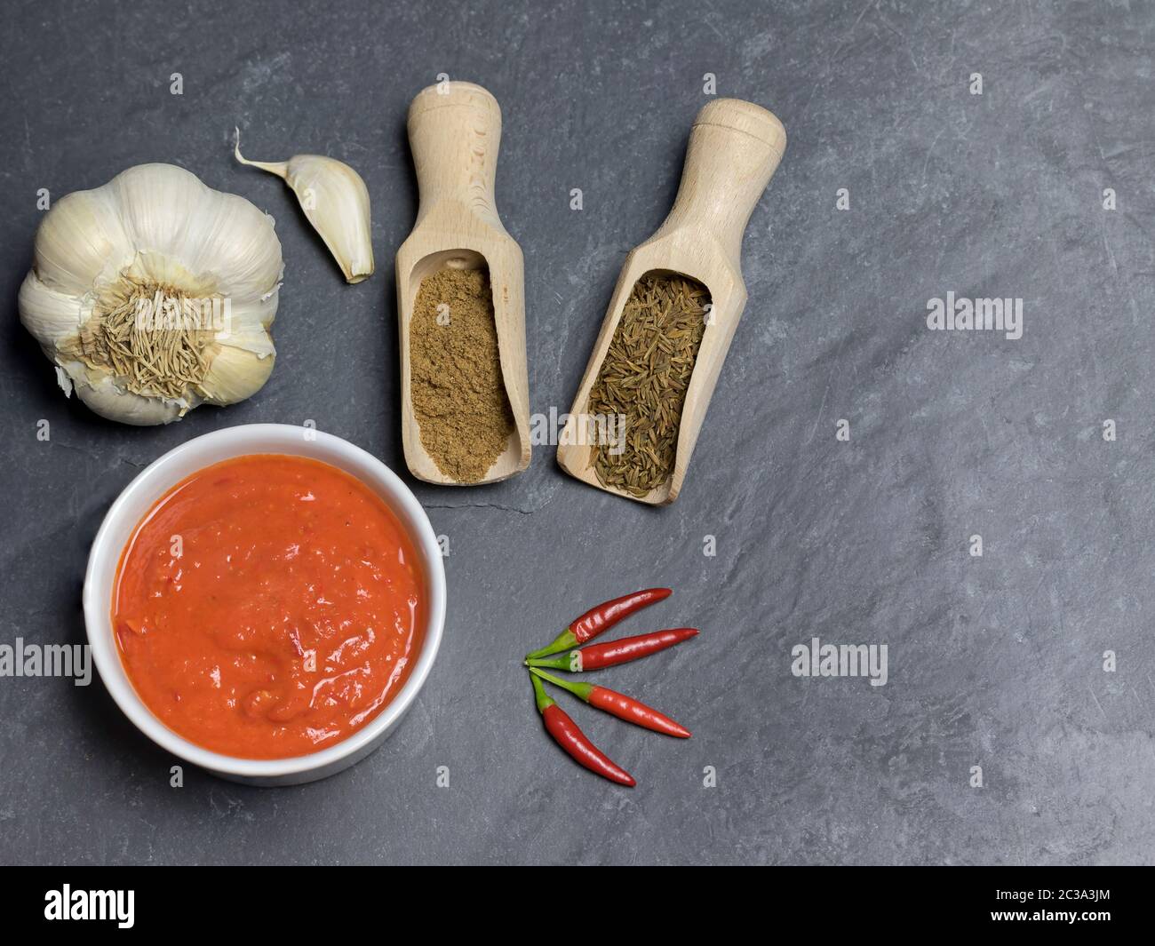 Top view of the Harissa sauce, coriander, roman cumin, garlic and ...