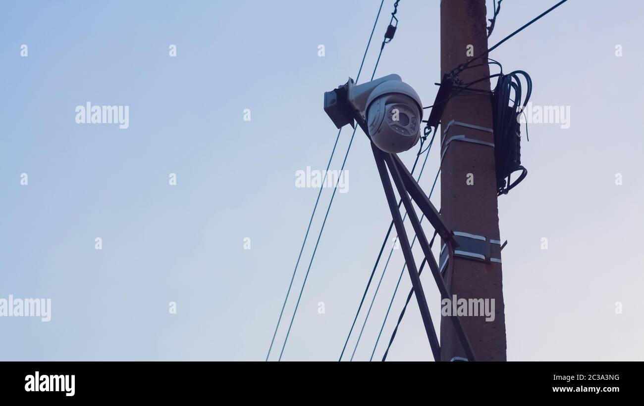 Security camera on the pole. Street video surveillance. eye of God ...